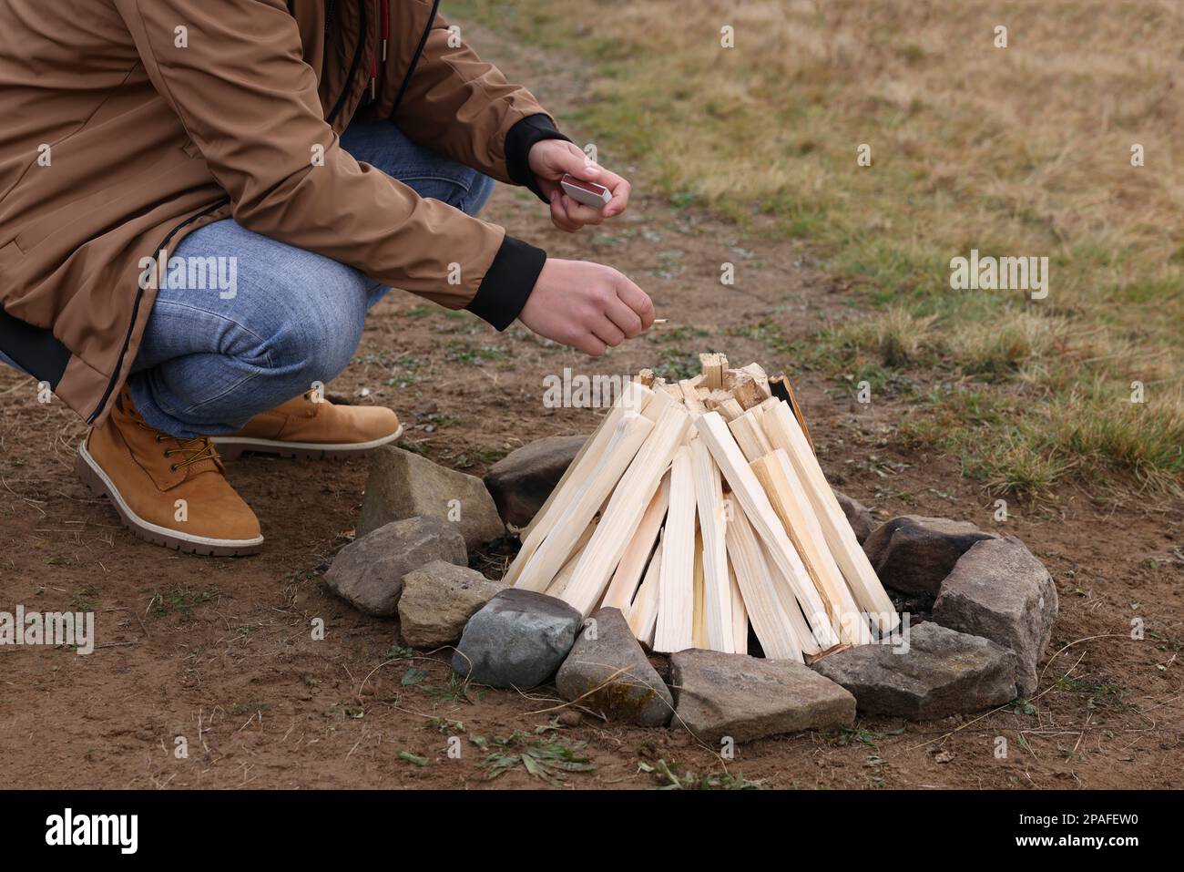 Man making fire stones hi-res stock photography and images - Alamy