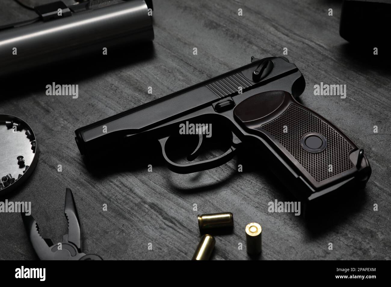 Standard handgun on dark table. Semi-automatic pistol Stock Photo - Alamy