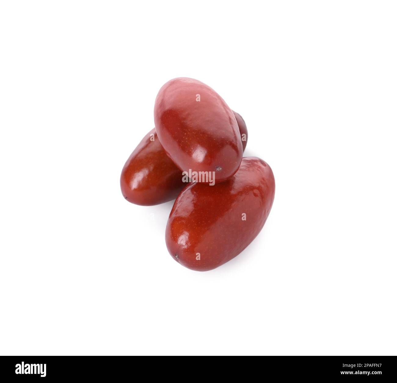 Three ripe red dates on white background Stock Photo - Alamy
