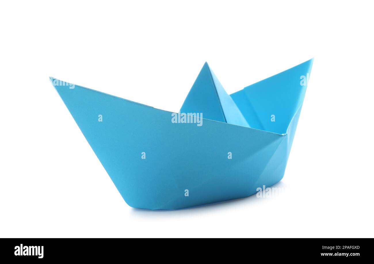 Handmade light blue paper boat isolated on white. Origami art Stock ...
