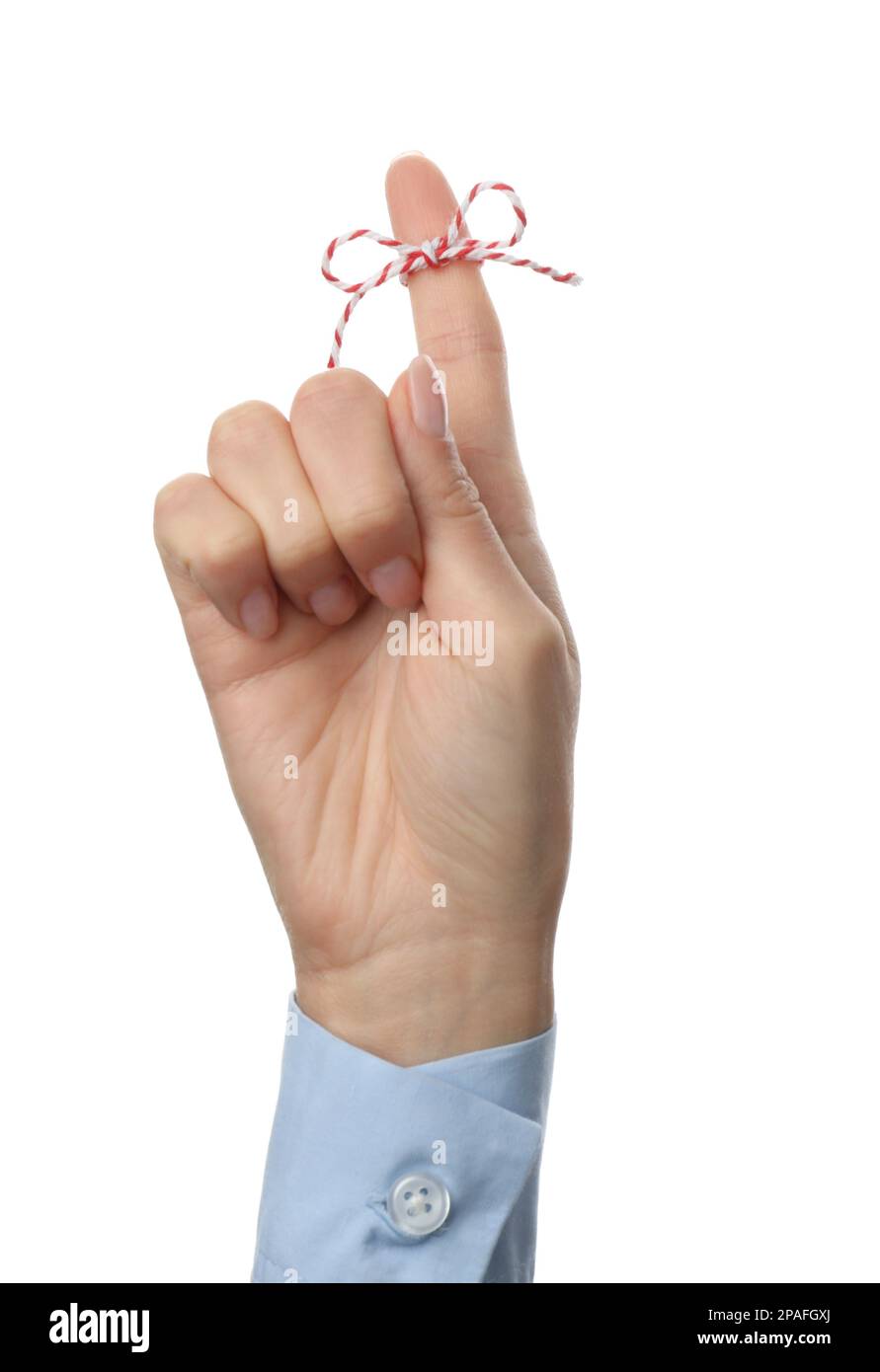 Woman showing index finger with tied bow as reminder on white ...