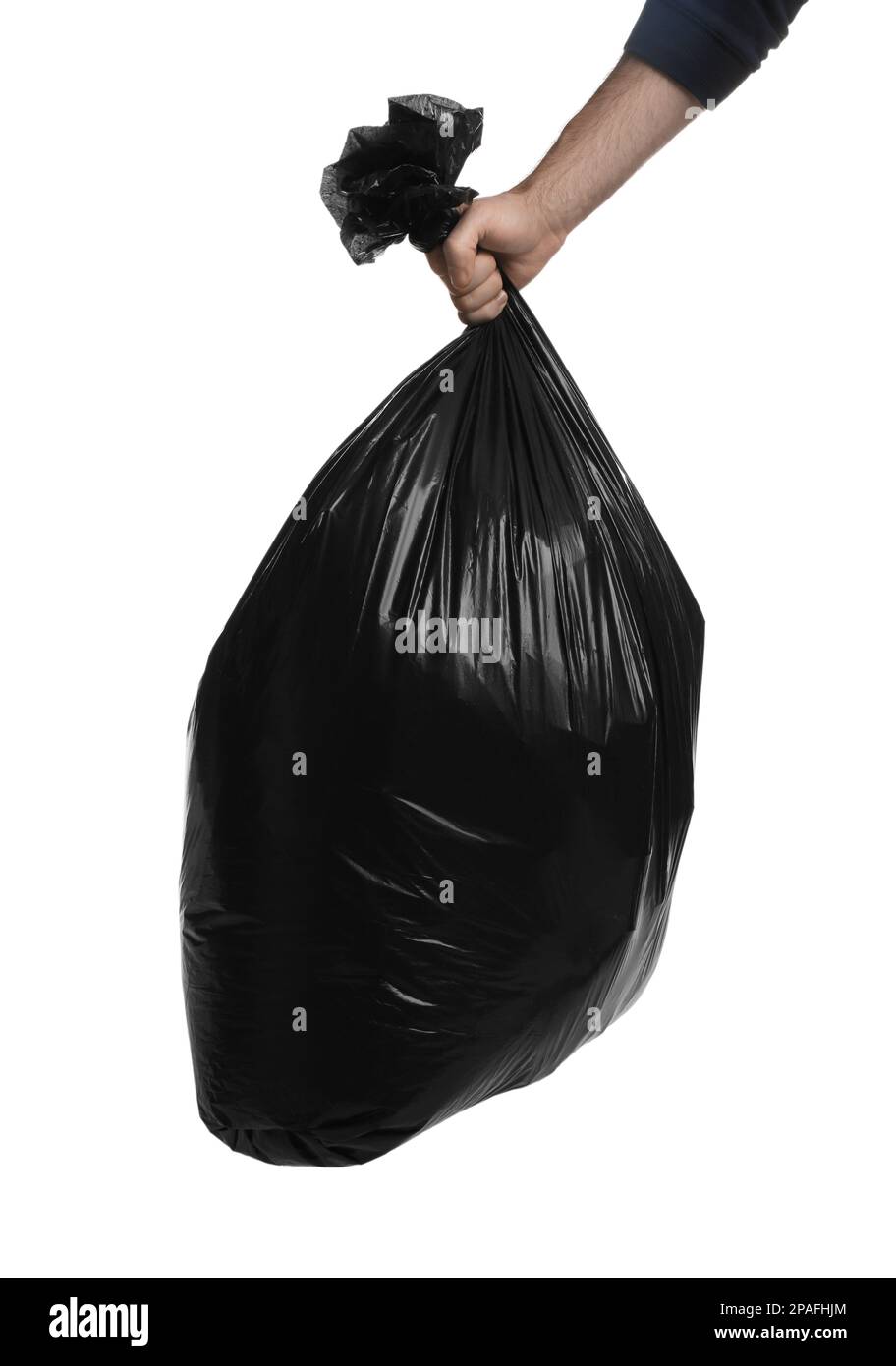 Man holding trash bag filled with garbage on white background, closeup ...