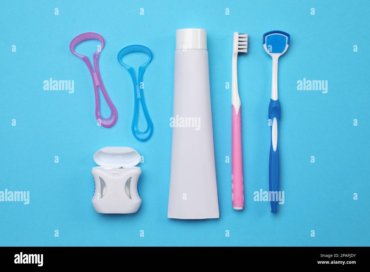 Flat lay composition with tongue cleaners and teeth care products on ...