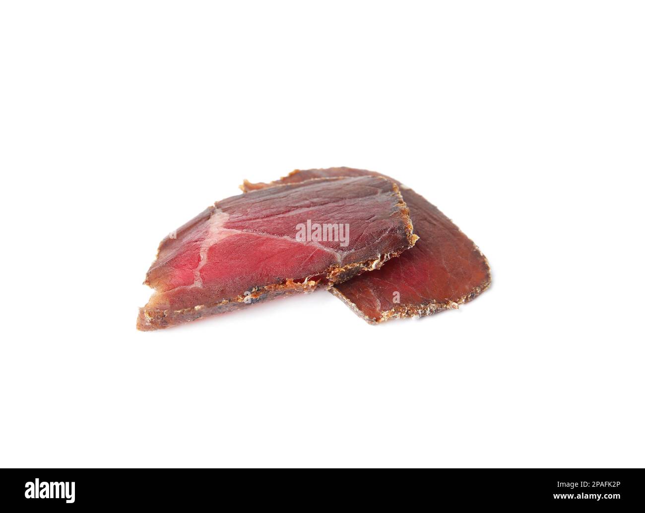 Delicious dry-cured beef basturma slices on white background Stock ...