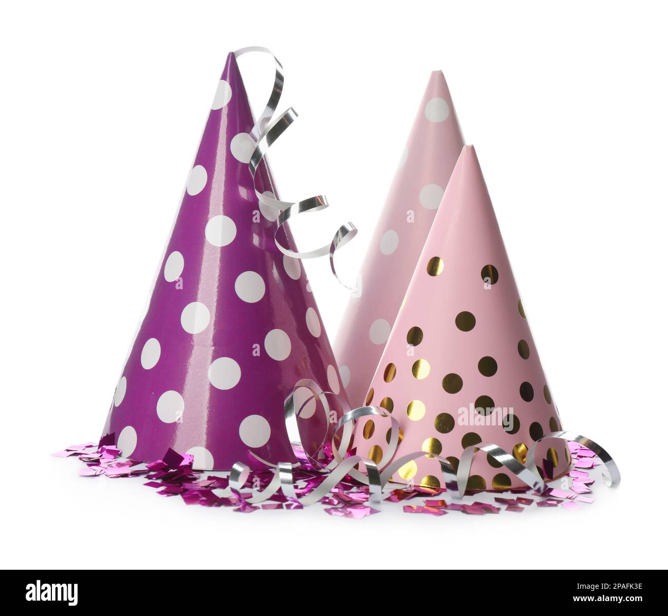 Colorful party hats and confetti on white background Stock Photo - Alamy