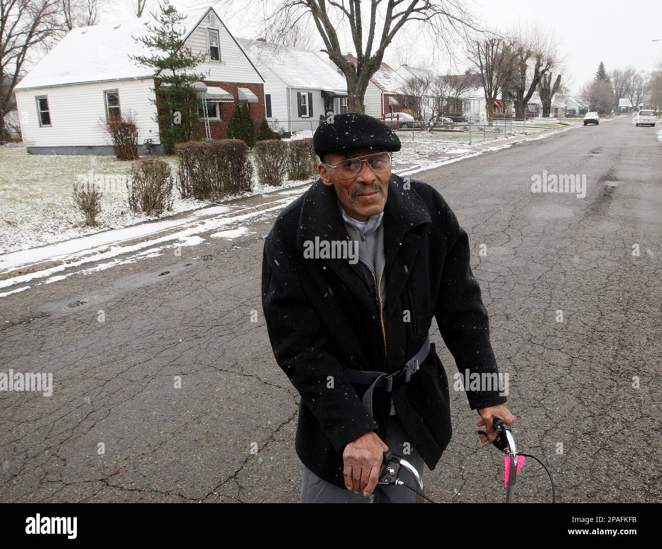 William Watkins walks around his neighborhood Hanford Village, Monday ...