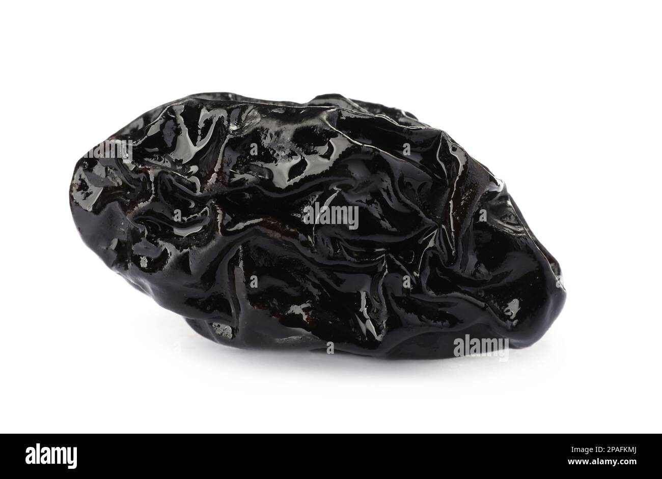 One sweet dried prune isolated on white Stock Photo - Alamy
