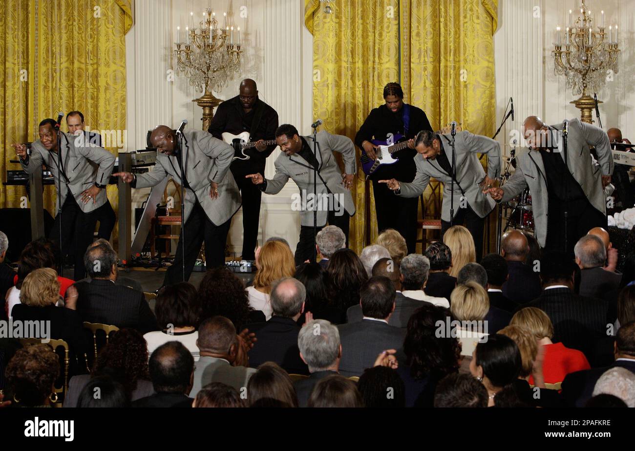 The Temptations perform for President Bush, seated, center back to ...