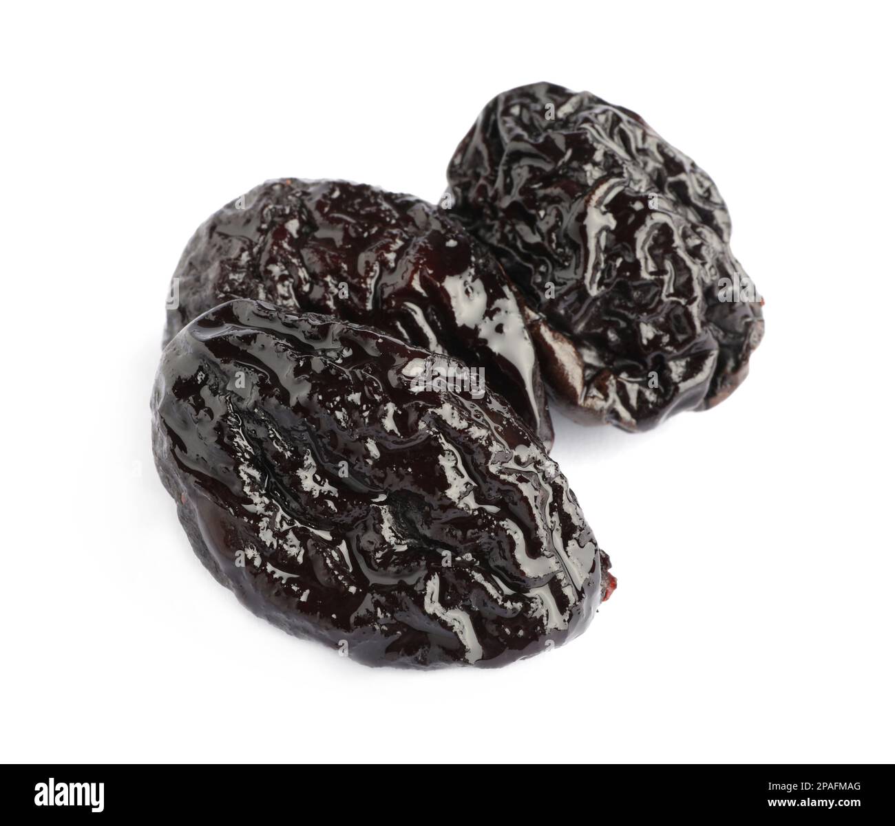 Sweet dried prunes on white background. Healthy snack Stock Photo - Alamy