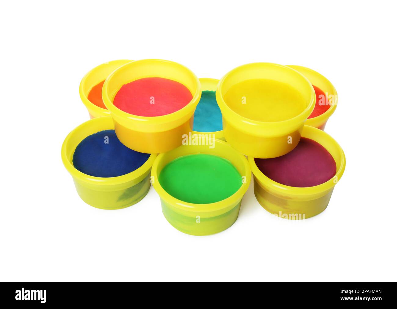 Plastic containers with colorful play dough on white background Stock ...