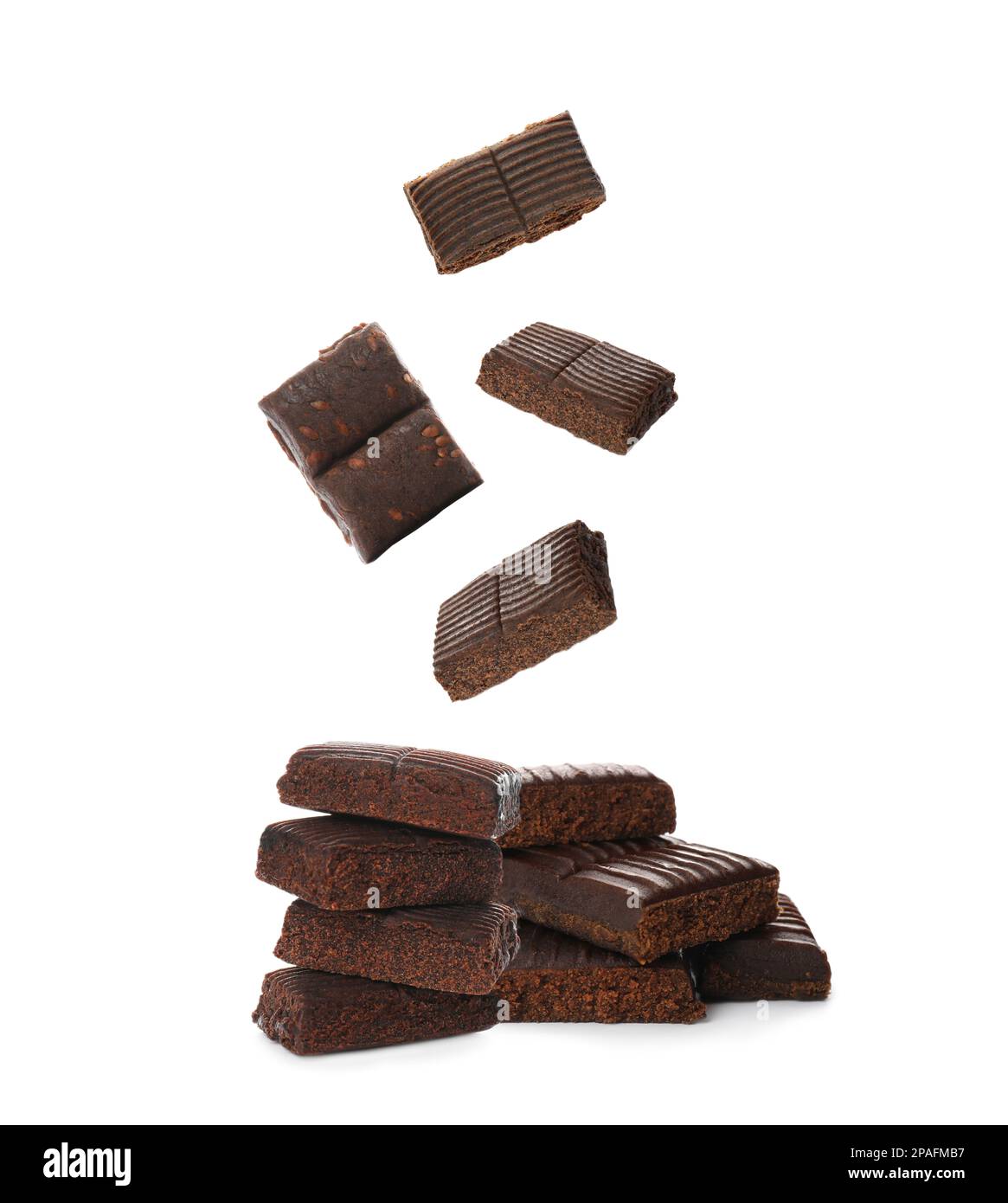 Hematogen bars falling into heap on white background Stock Photo - Alamy