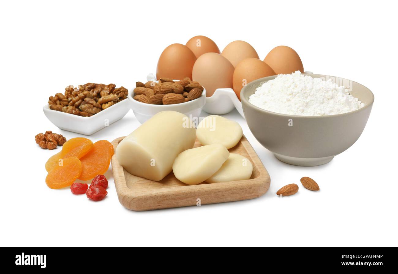 Marzipan and other ingredients for homemade Stollen on white background ...