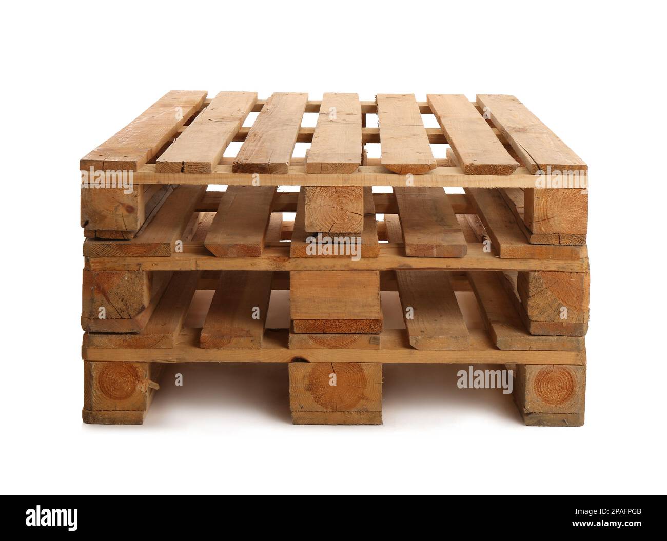Stacked wooden pallets isolated on white. Transportation and storage ...