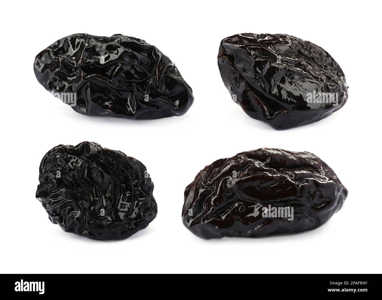 Set with sweet dried prunes on white background Stock Photo - Alamy