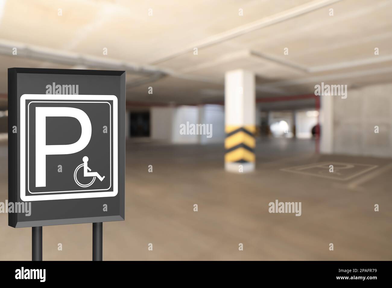 Sign with wheelchair symbol in car parking garage, space for text Stock ...