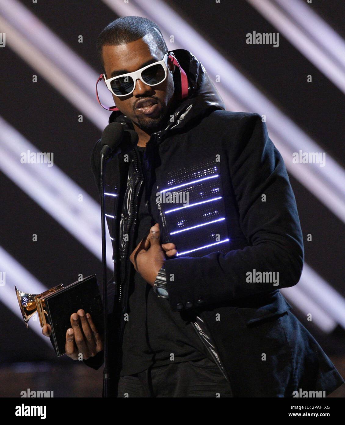 Kanye West accepts the award for best rap album for Graduation at the ...