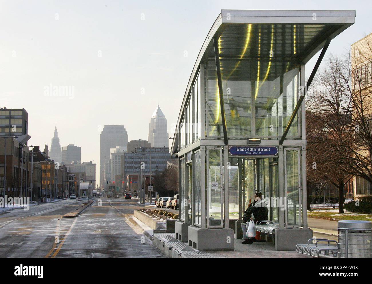 A woman sits inside a newly constructed bus stop near East 40th Street ...