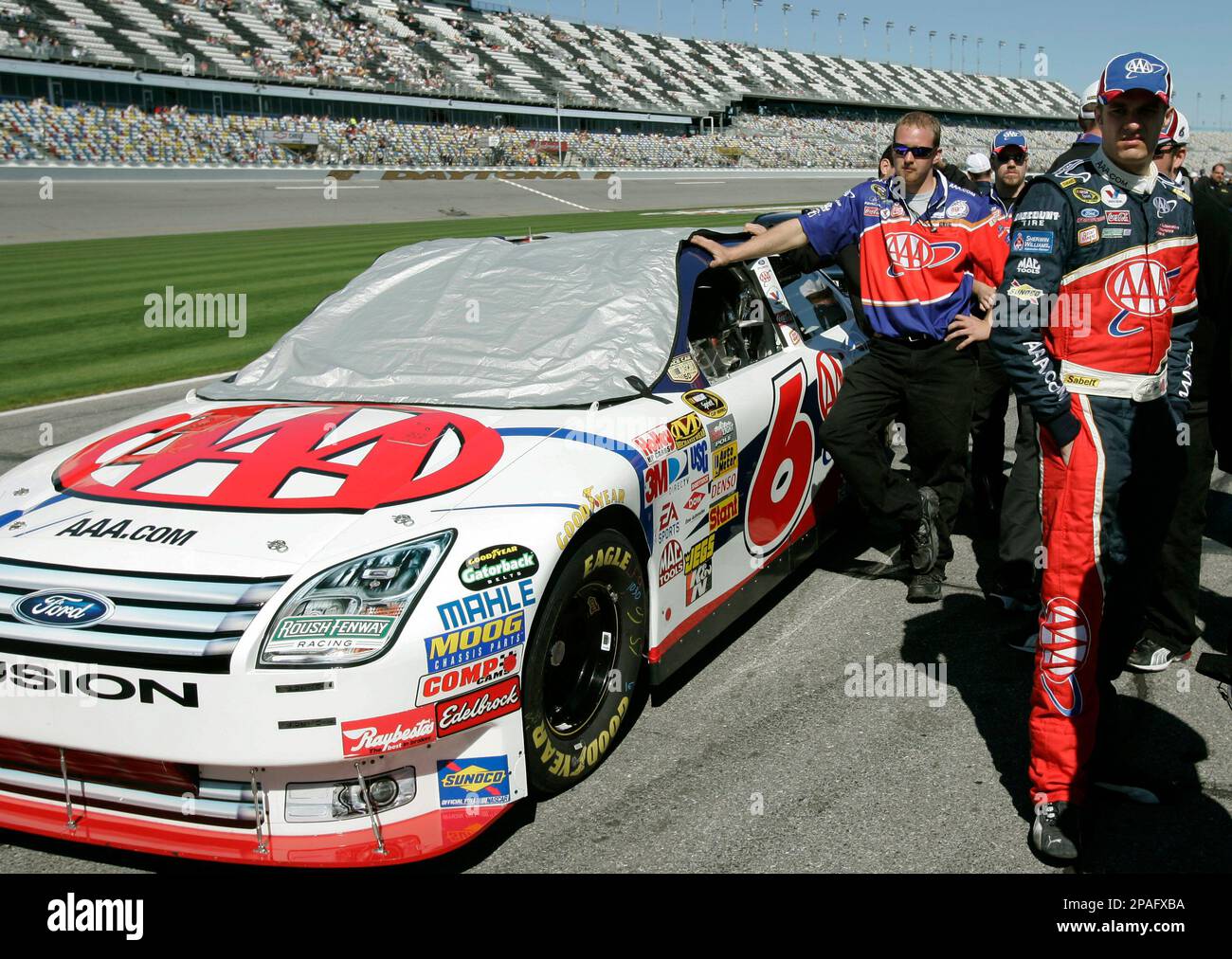 NASCAR driver David Ragan, right, waits to drive his qualifying laps at ...