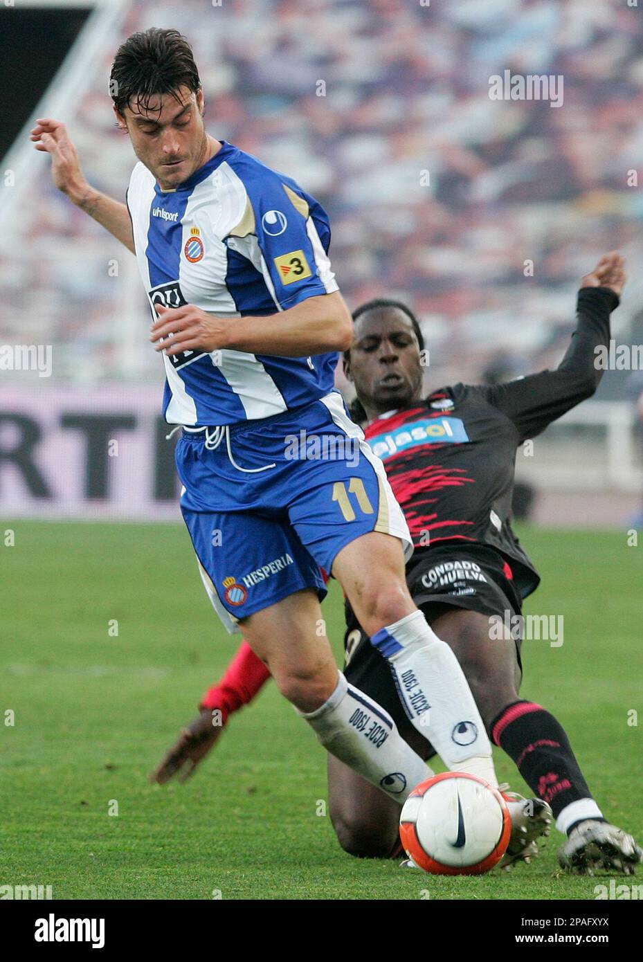 Espanyol player Albert Riera Ortega, left, duels for the ball against ...