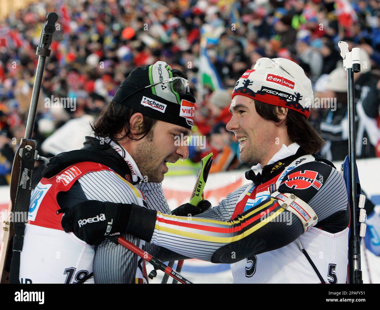 Michael Roesch, Germany, right, arms Alexander Wolf, Germany, left, in ...
