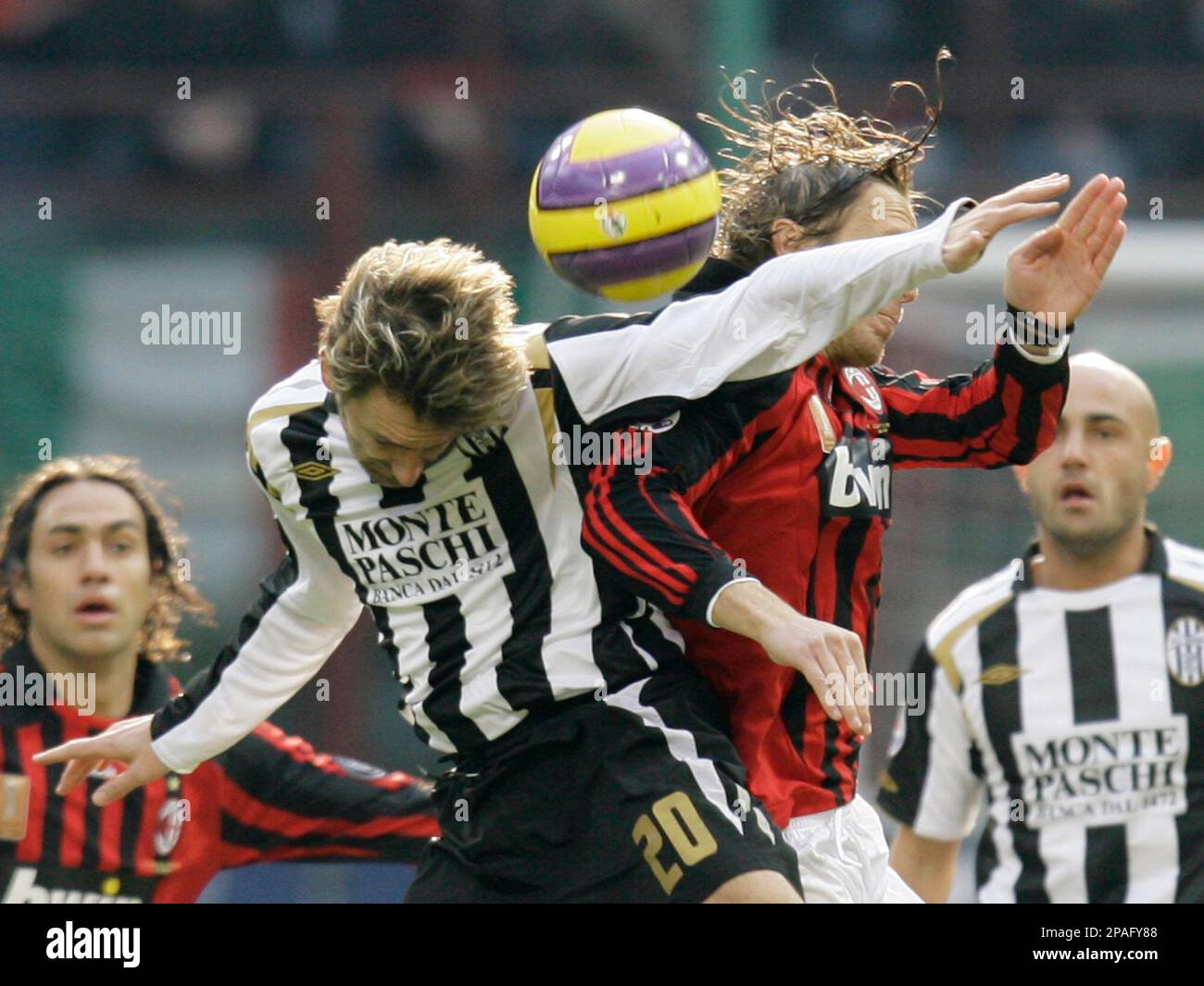 AC Milan midfielder Massimo Ambrosini, right, and Siena forward Tomas ...