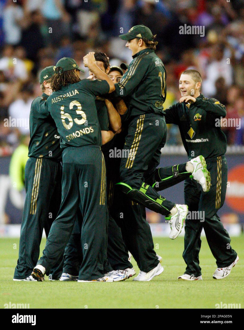 Australian players celebrate the wicket of India's Sachin Tendulker ...