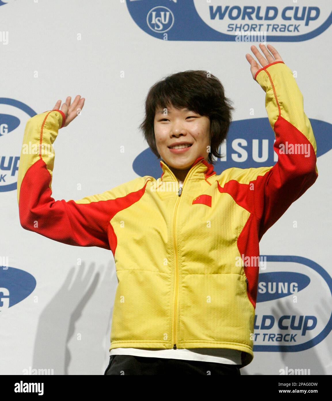 China's Zhou Yang waves on the podium after the ladies 1,500m meter ...