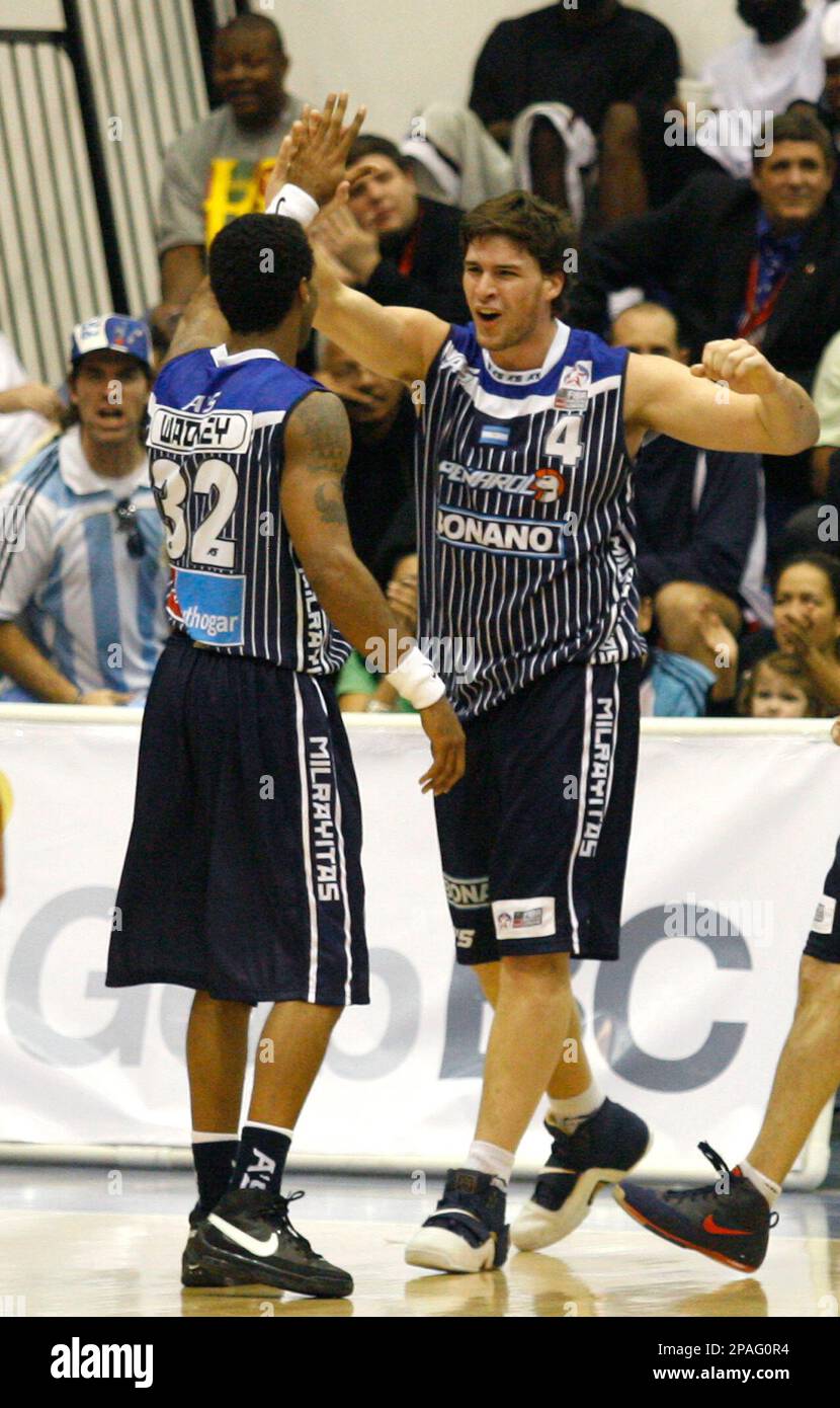 Alejandro Diez, of Argentina's Penarol, right, is congratulated by ...