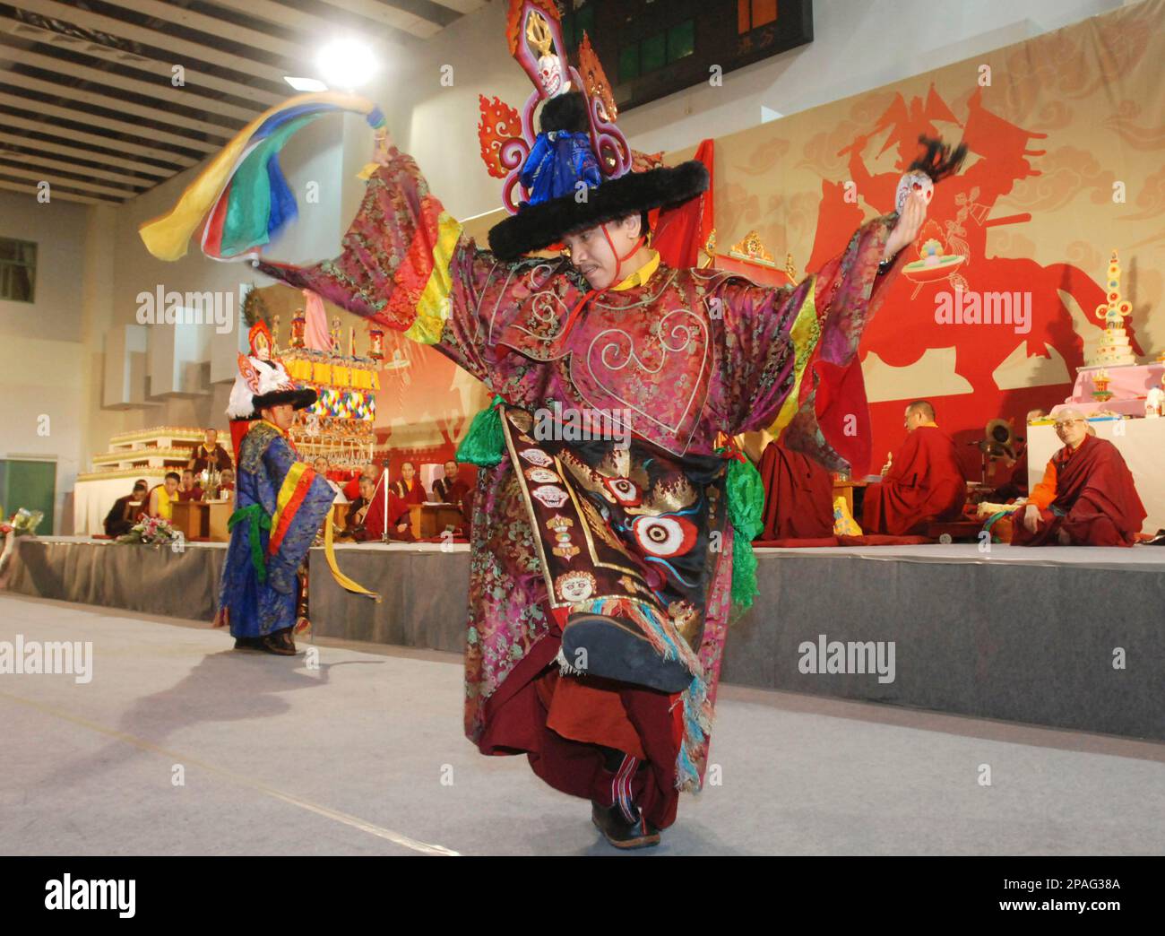 Tibetan monks dance during a Tibetan Buddhism ceremony celebrating the ...