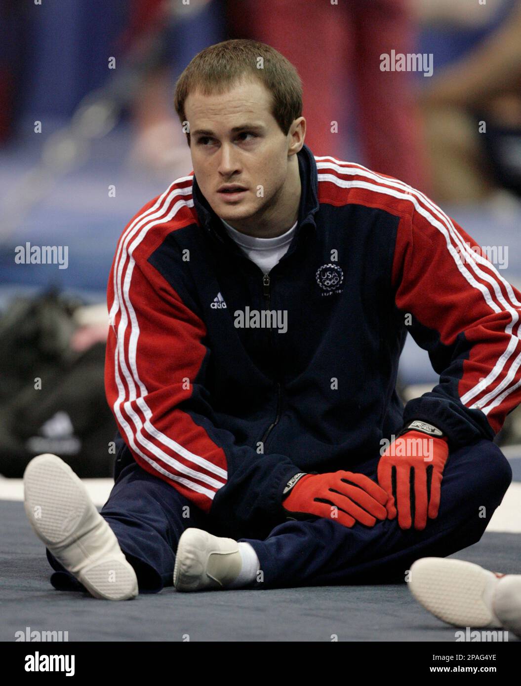 Olympic gold medalist Paul Hamm stretches during practice for the men's Winter Cup gymnastics ...