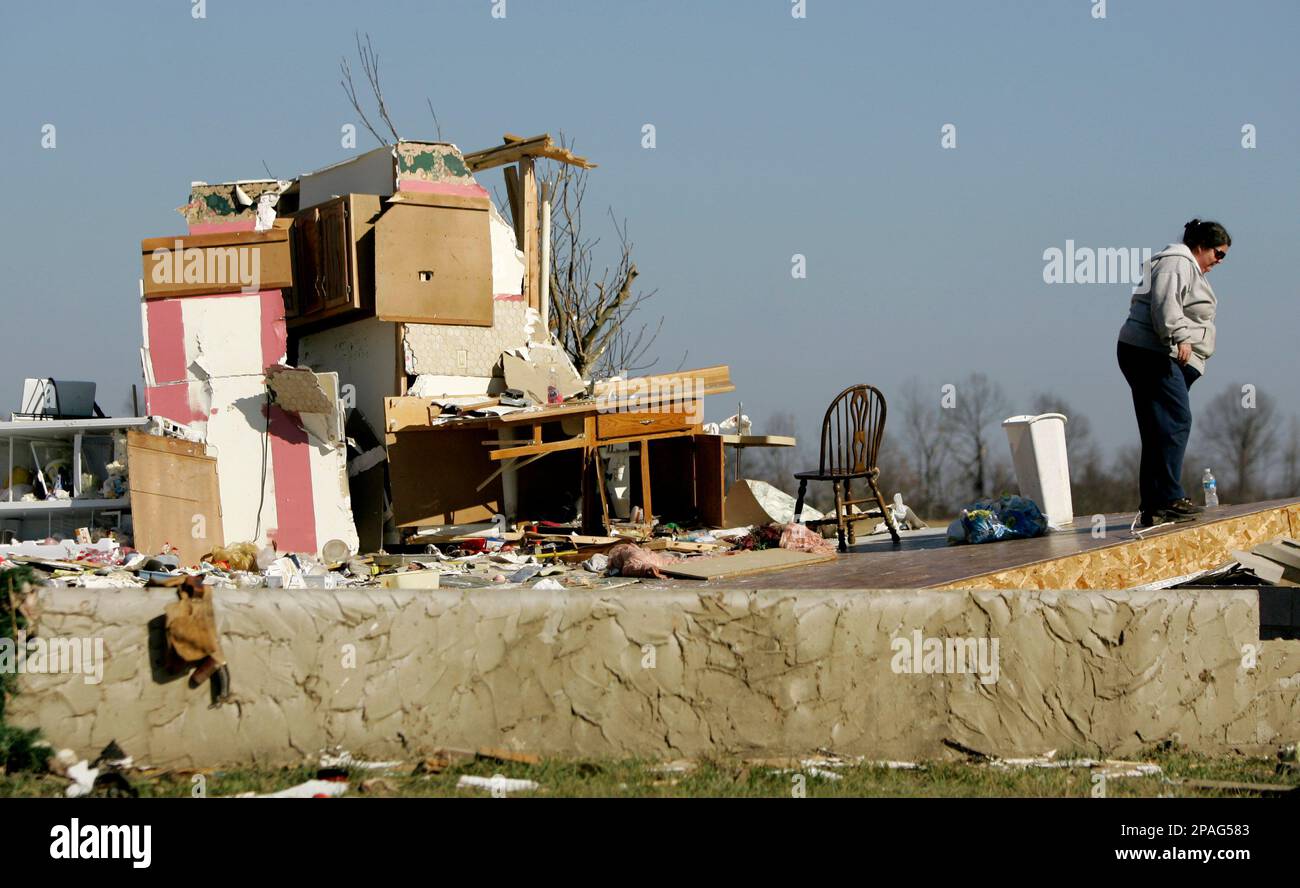 Cynthia Anderson looks for salvageable items at her nephew's destroyed ...
