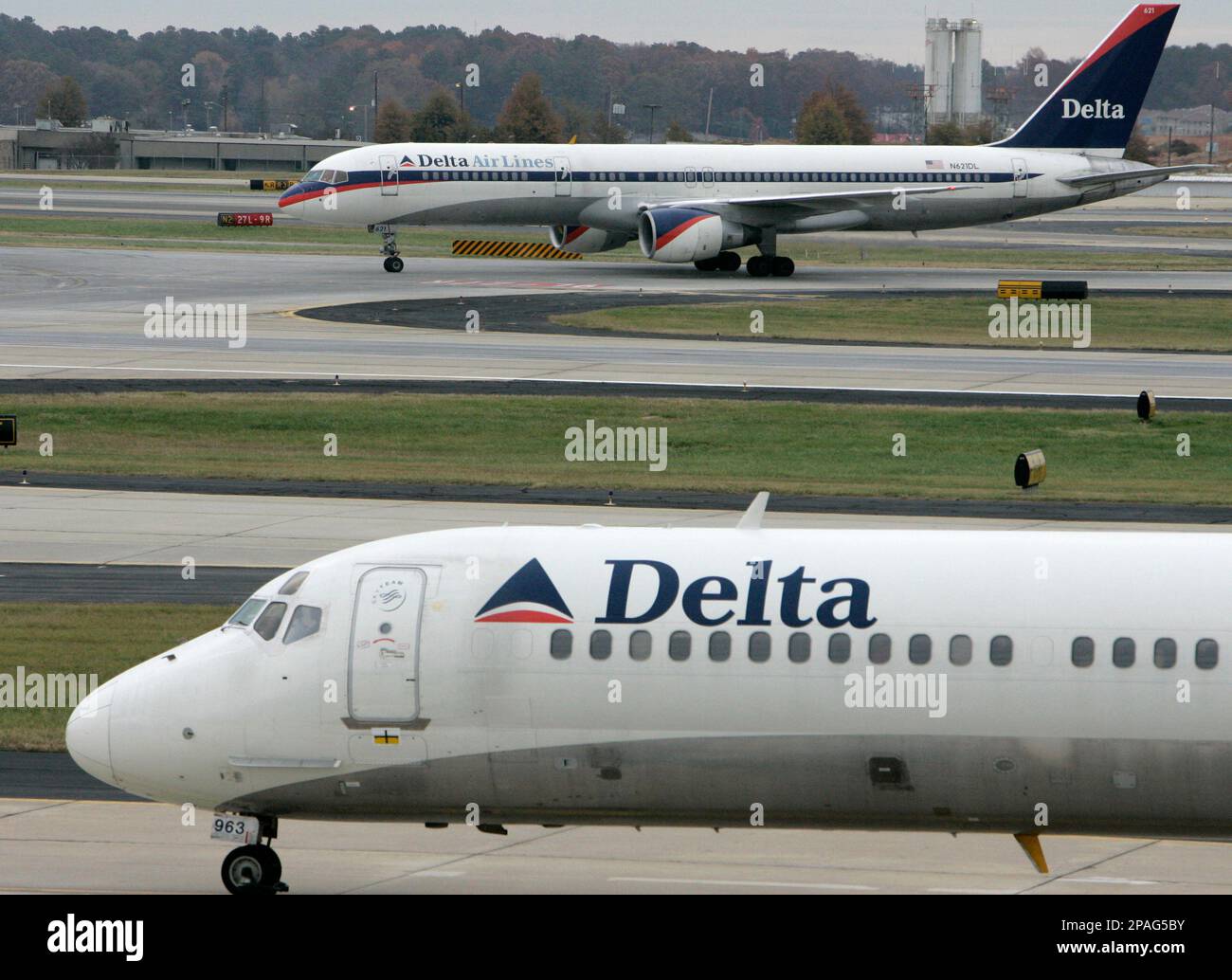 **FILE** Delta Air Lines jets line up on the tarmac at Hartsfield ...