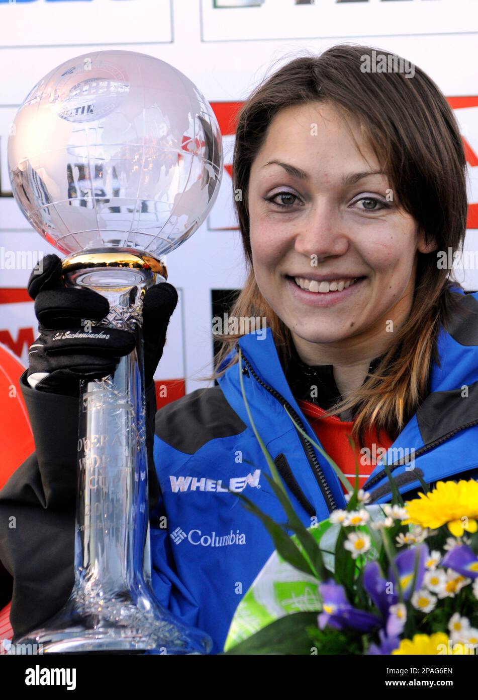 Katie Uhlaender from the US poses with the trophy as World Cup overall ...