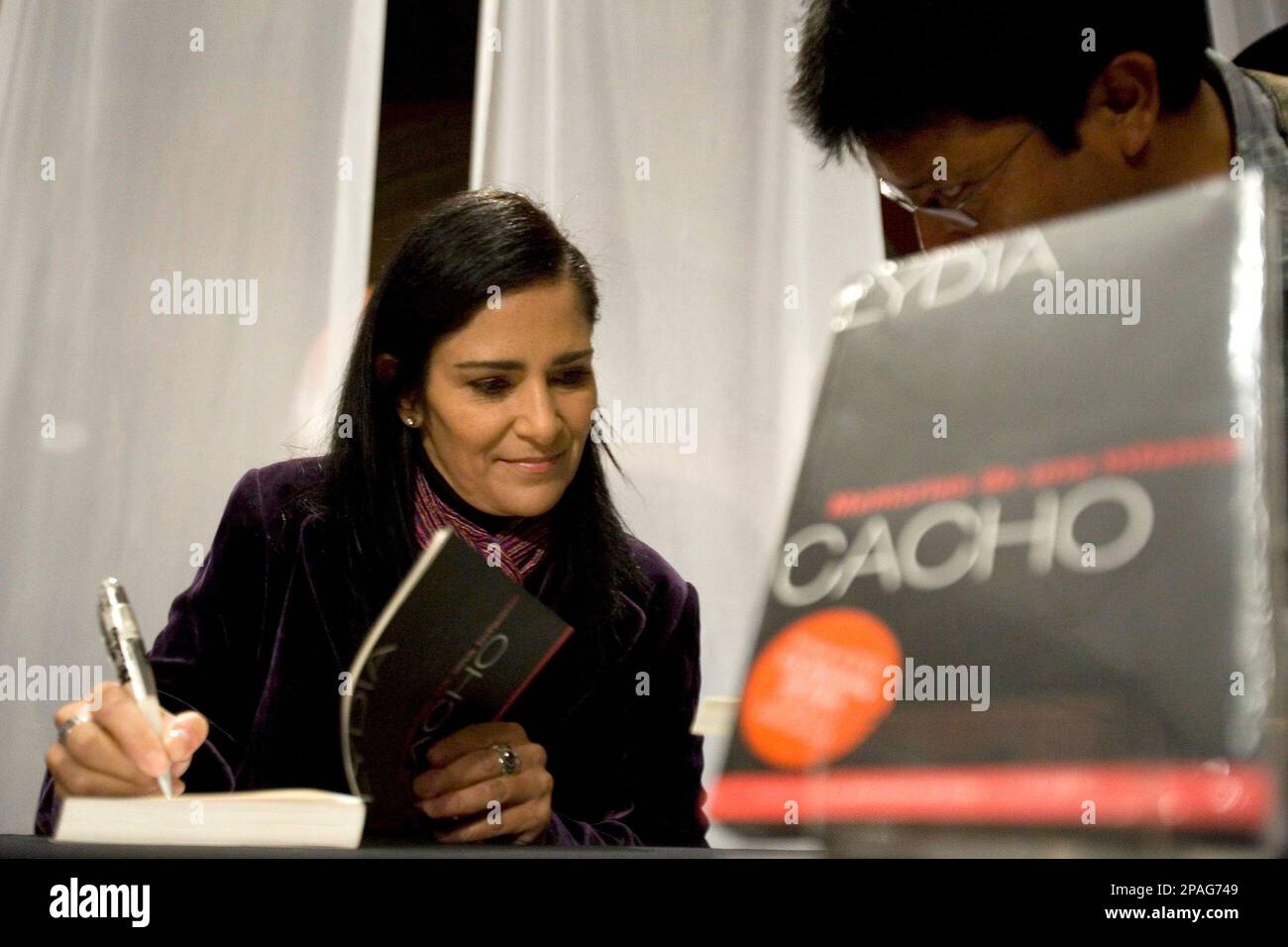 Mexican journalist Lydia Cacho signs copies of her new book "Memorias ...