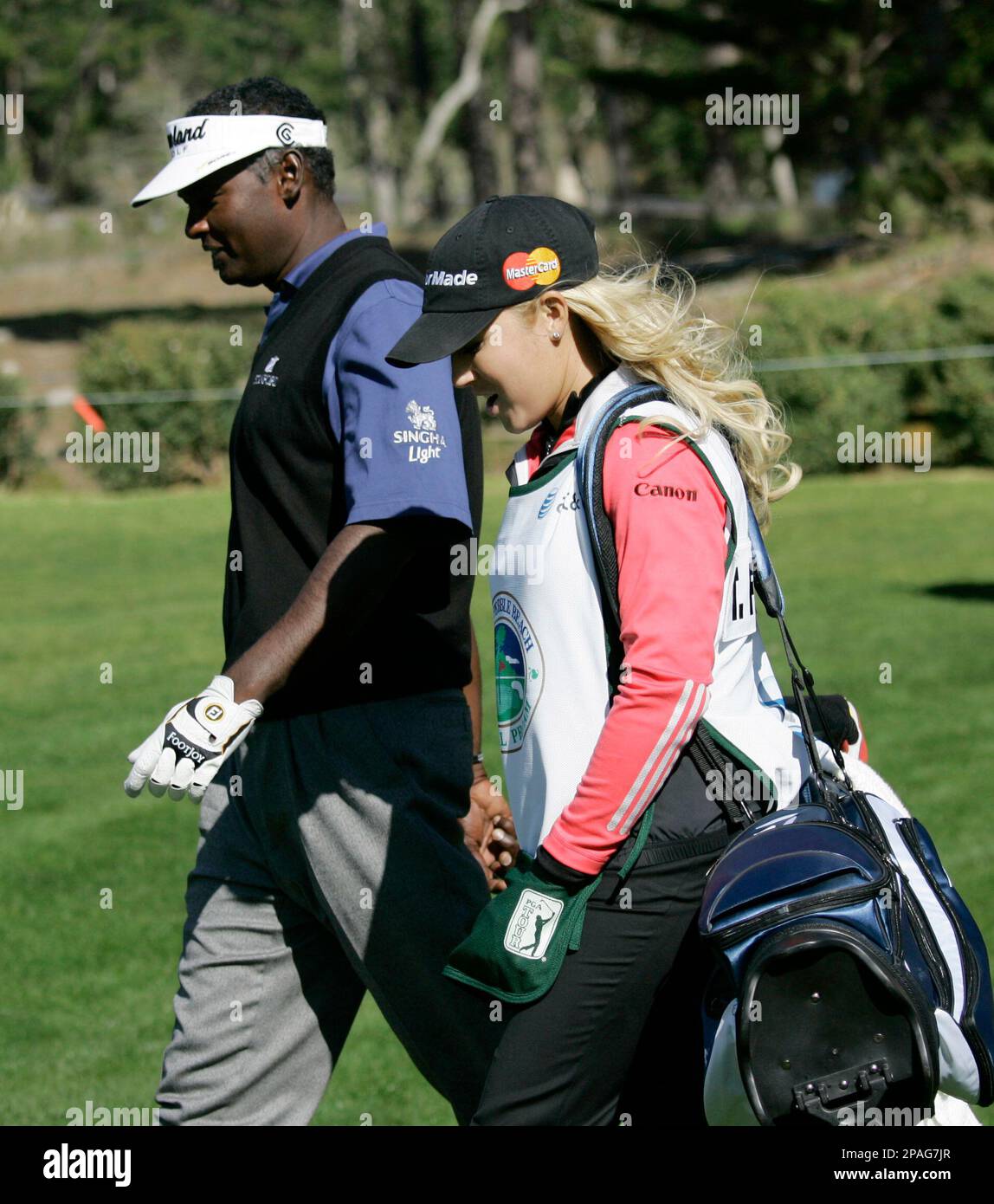 Natalie Gulbis, right, who plays on the LPGA Tour, walks with Vijay ...