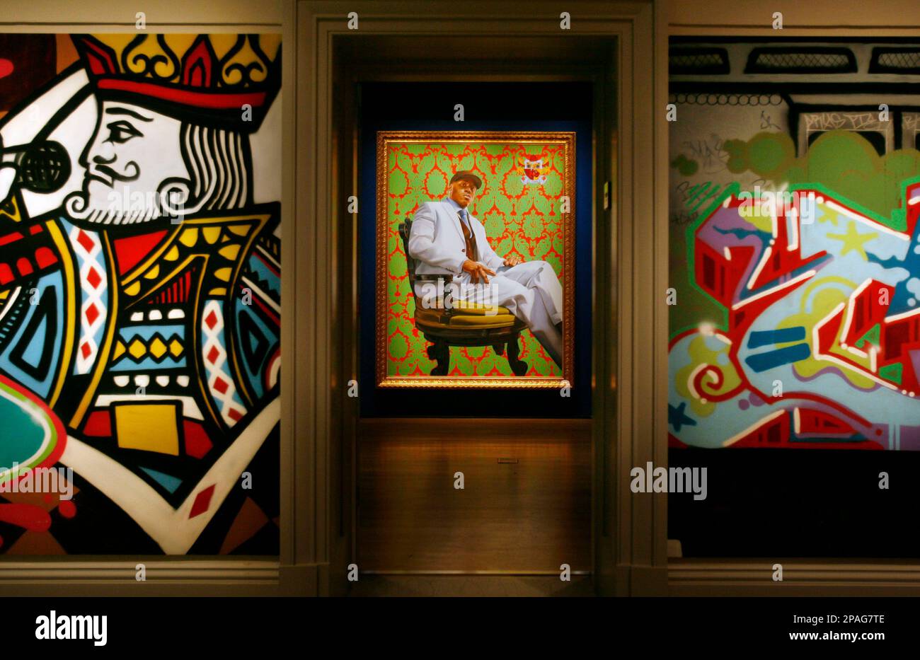 A painting of LL Cool J, center, by Kehinde Wiley, is seen in a gallery ...