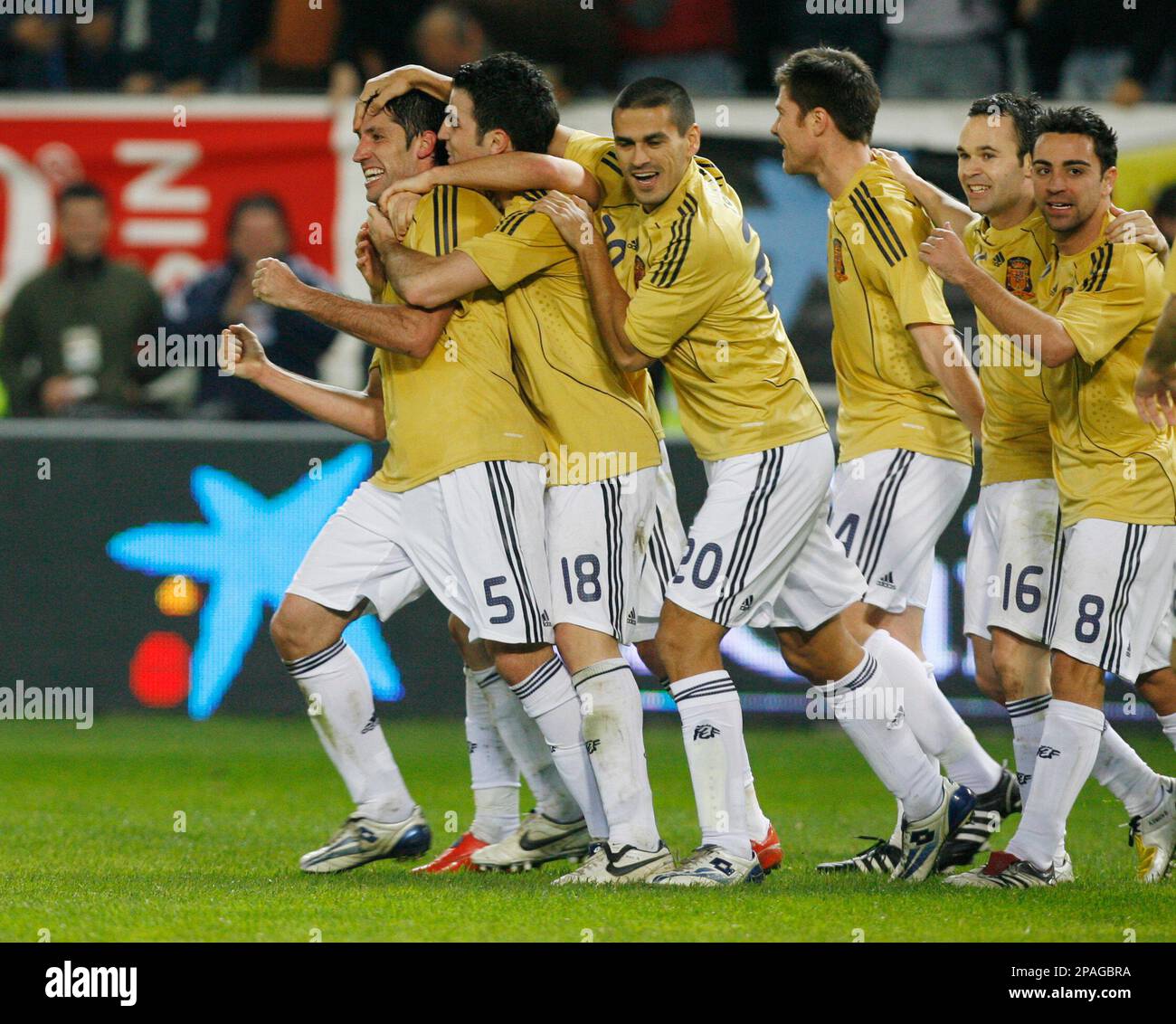 Spain's Joan Capdevila, left, celebrates with teammates after he scored ...
