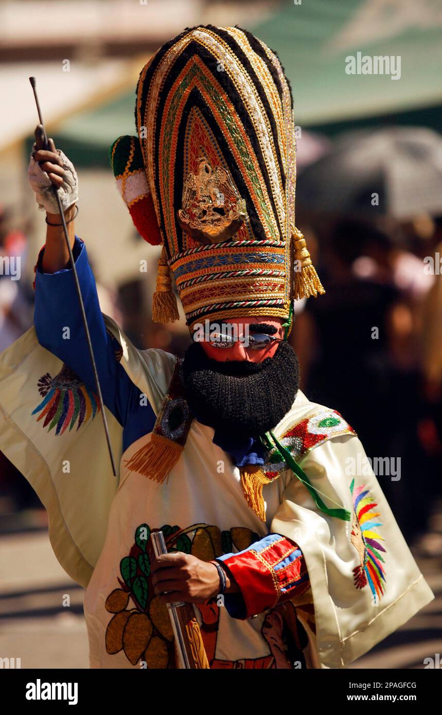 A man loads his musket during Carnival celebrations in Huejotzingo ...