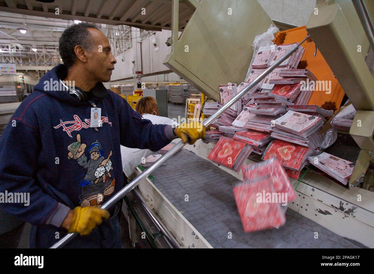 A mail handler breaks bundles of business mail at the United States ...