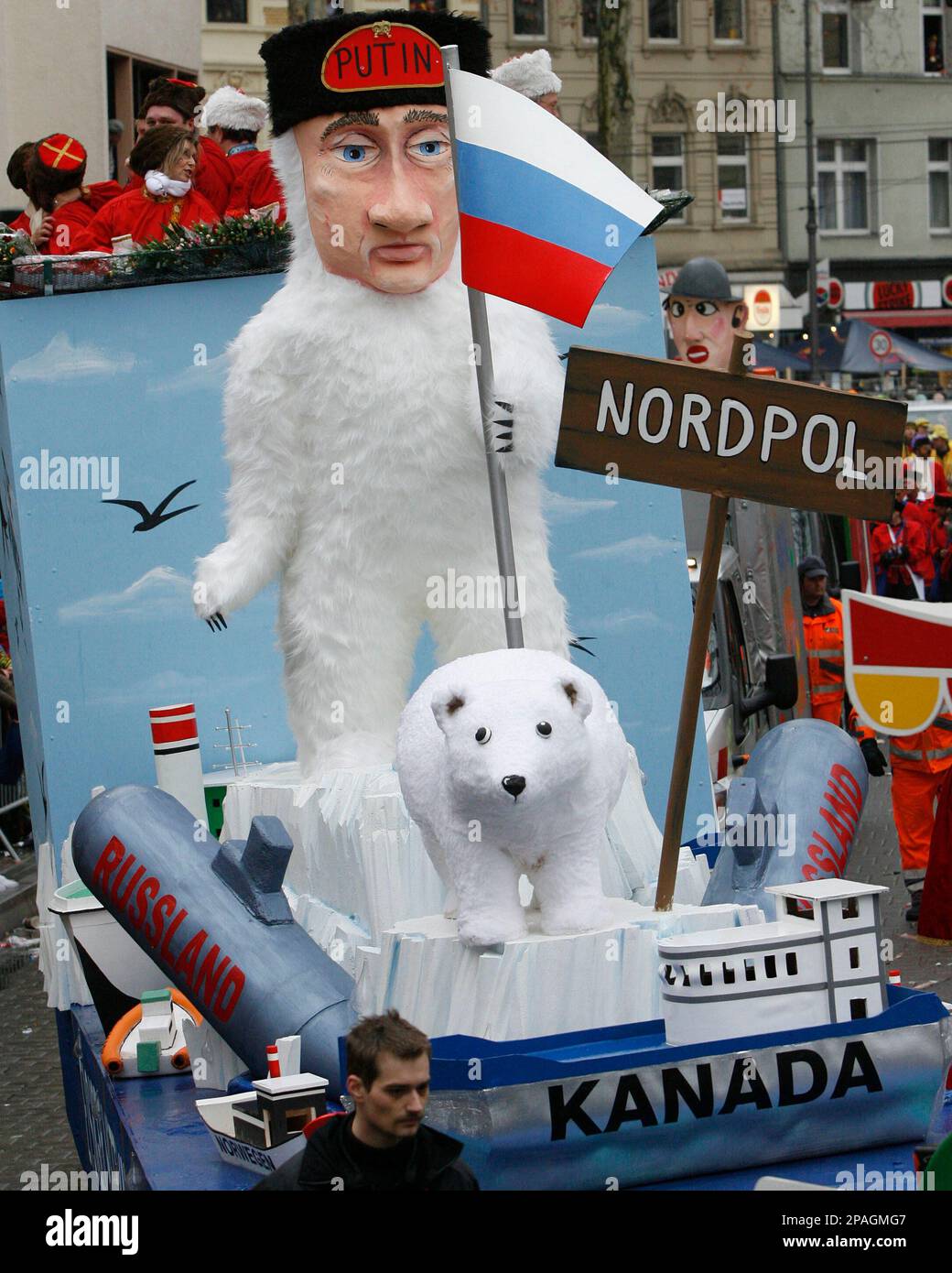 A puppet depicting Russia's President Vladimir Putin, setting a flag on ...