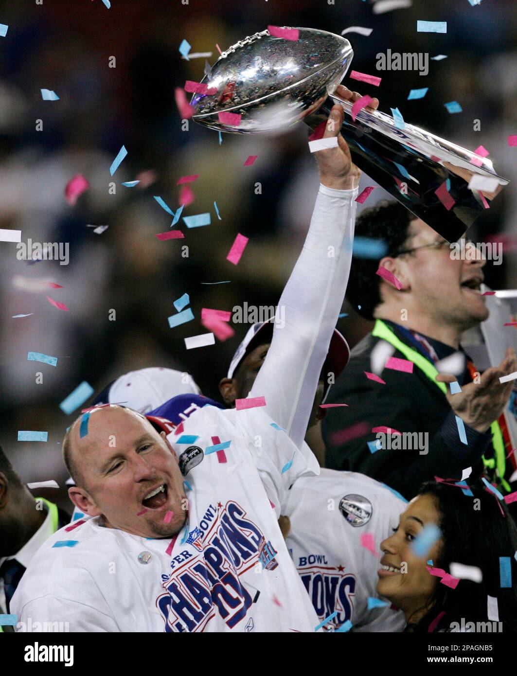 New York Giants punter Jeff Feagles holds the Vince Lombardi Trophy ...