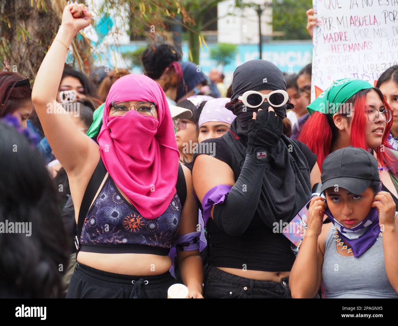 A group of masked women when hundreds of women took to the streets to ...