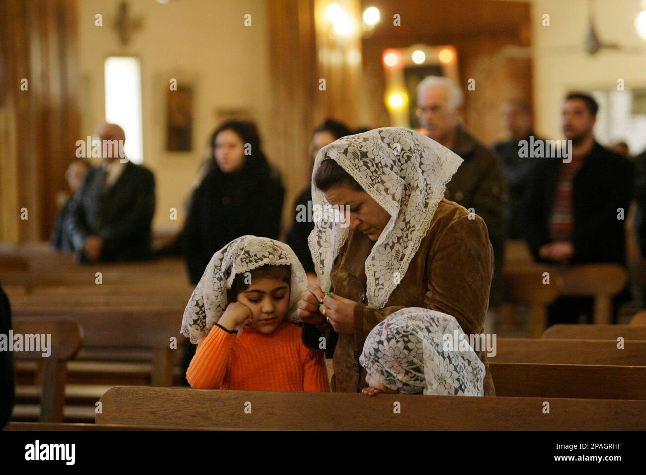 Iraqi Christians pray in St. Joseph's Chaldean church in Baghdad, Iraq ...