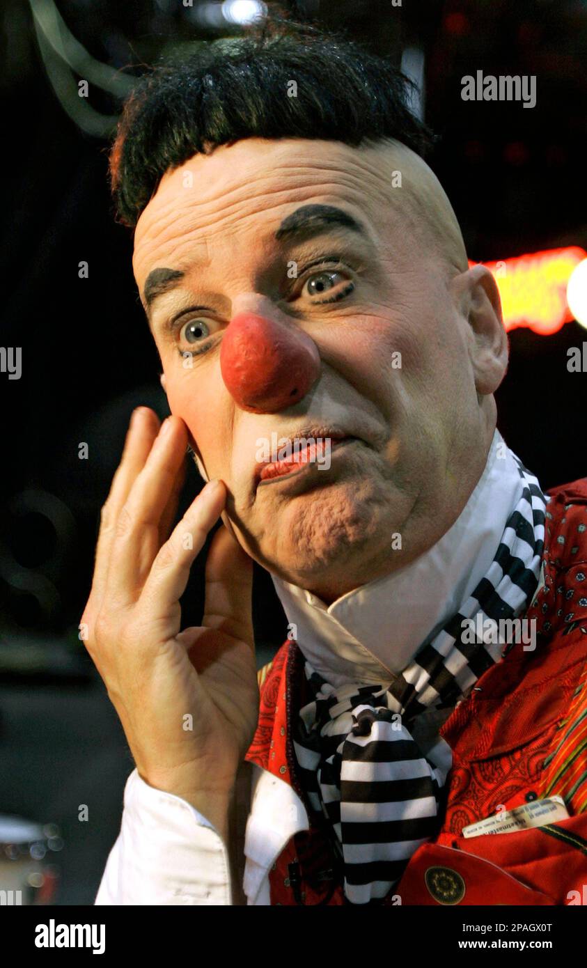 Tom Dougherty, aka, Tom the clown poses during an interview for ...