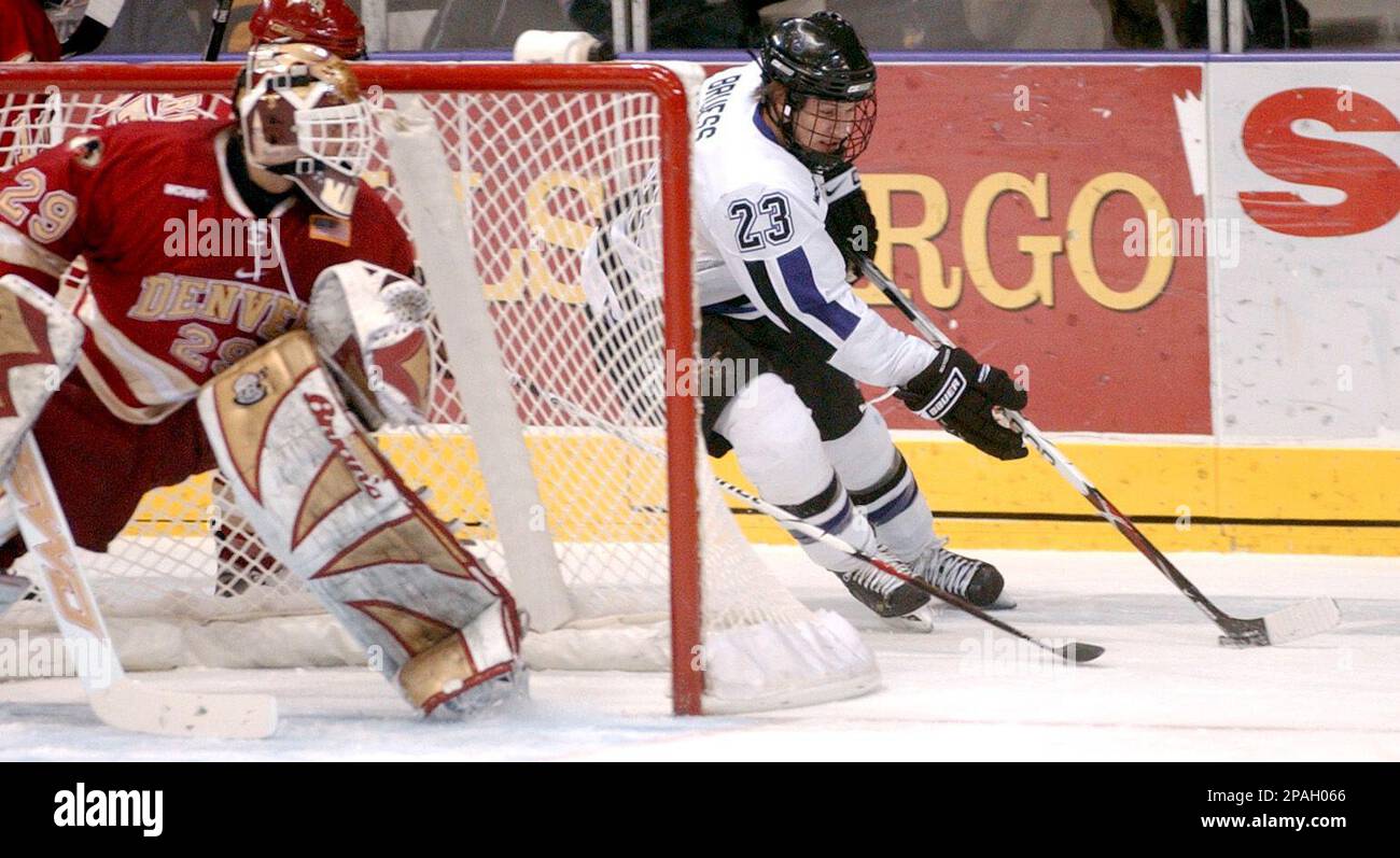 Minnesota State, Mankato's Trevor Bruess, right, looks to shoot around ...