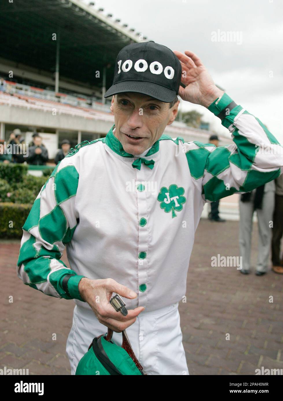 Hall of Fame jockey Russell Baze puts on a new hat after winning his 10 ...