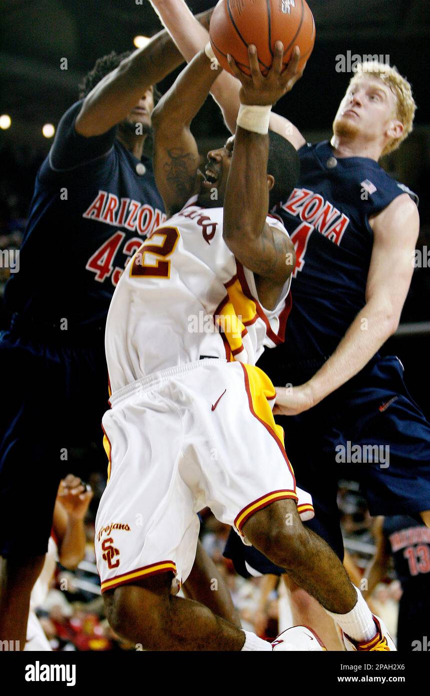 Southern California's O.J. Mayo, center, is double teamed by Arizona's ...