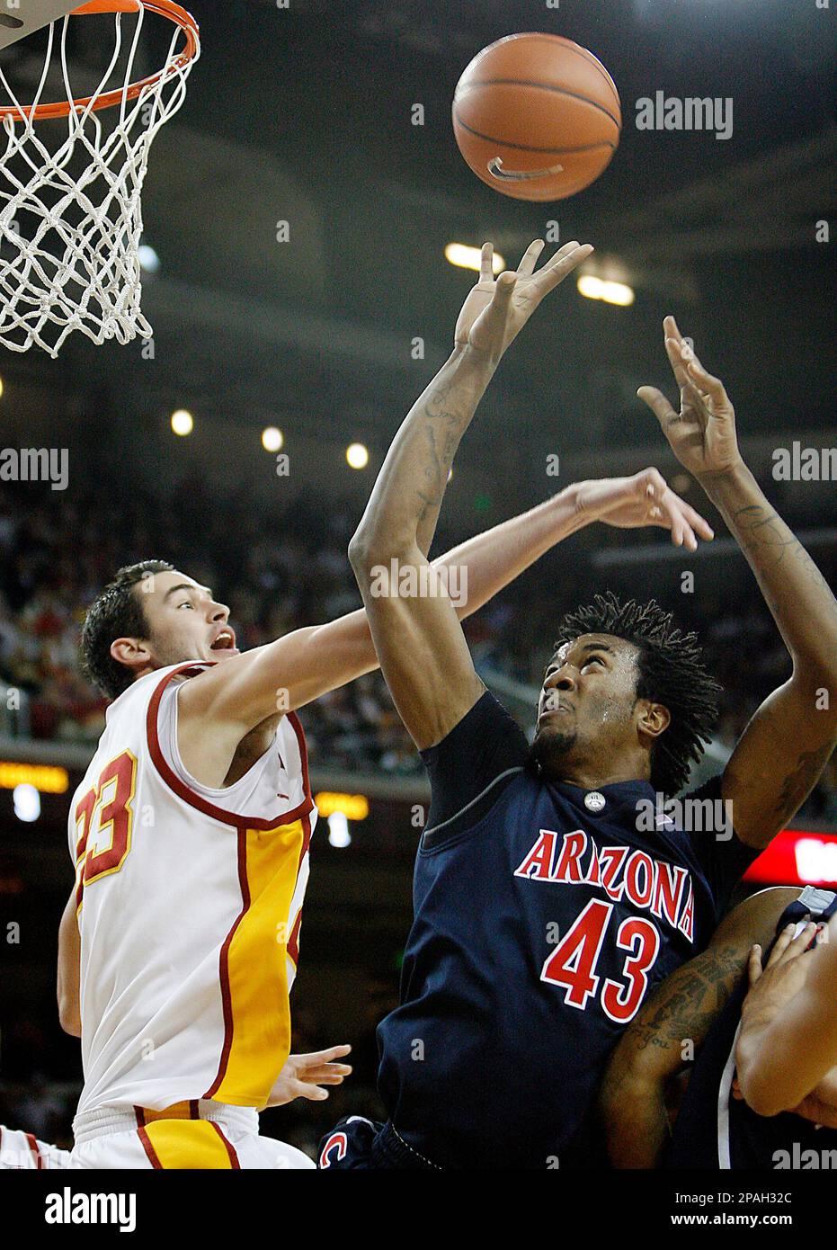Arizona's Jordan Hill (43) and shoots over Southern California's Keith ...