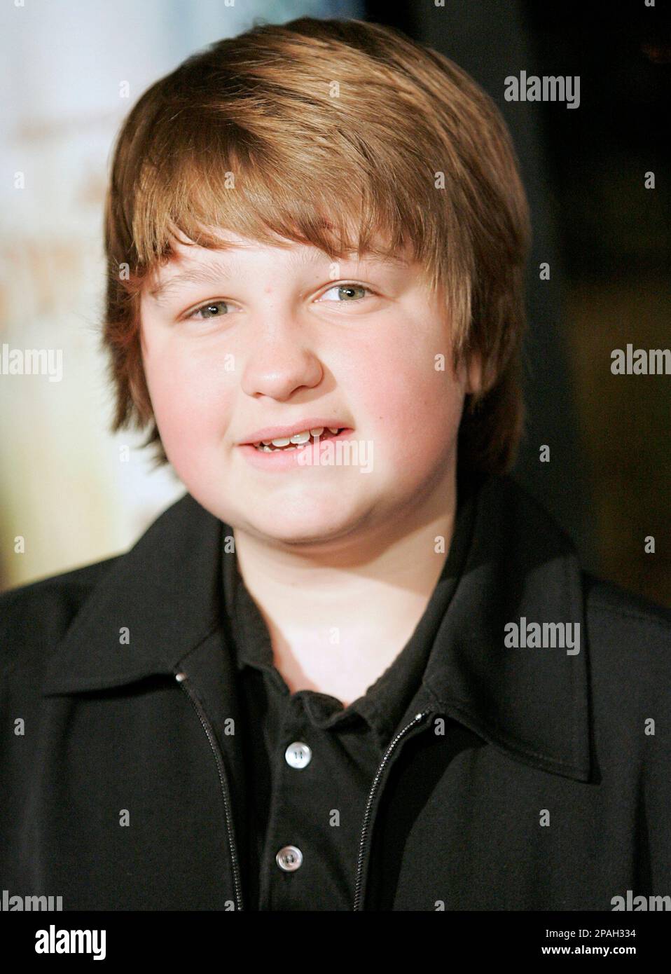 Actor Angus T. Jones poses on the press line at the premiere of the ...