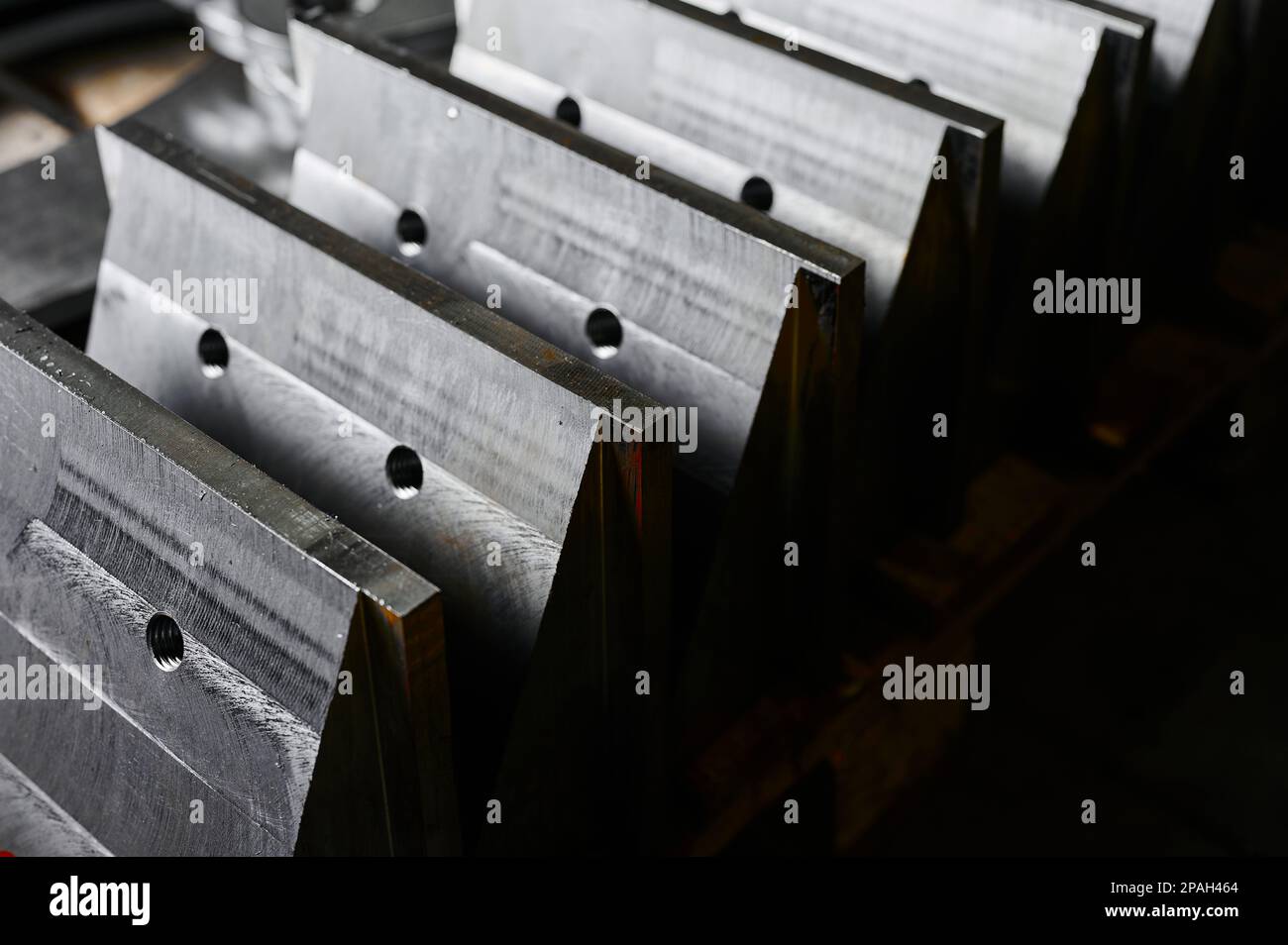 Processed metal plates with ground edges in warehouse Stock Photo - Alamy